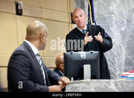 Broward Circuit Judge John J. Murphy lll presides over the double ...
