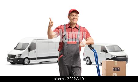 Travailleur avec une camionnette et une pile de boîtes chargées sur un ...