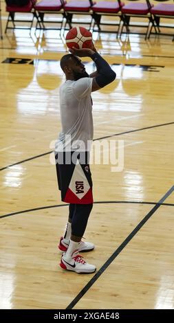 NBA basketball player LeBron James, center, poses with his high school ...