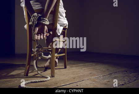 Jeune femme ligotée par corde isolated on white Photo Stock - Alamy