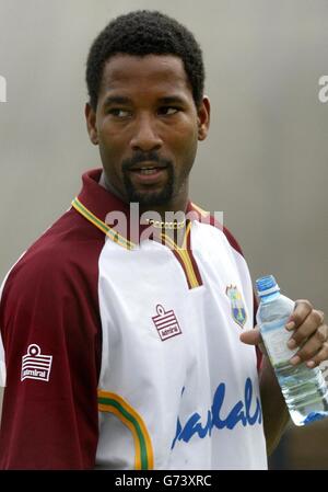 West Indies bowler Corey Collymore, right, celebrates the dismissal of ...