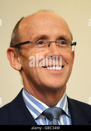 Mervyn Davies, Chairman of Standard Chartered Bank PLC., drinks during ...