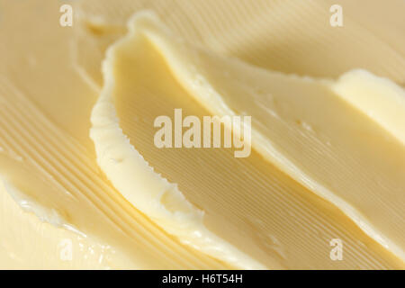 Beurre mou se propager dans une forme abstraite Photo Stock - Alamy