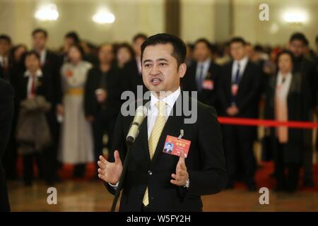 Ding Shizhong, président et chef de l'Anta Sports Produits, également ...