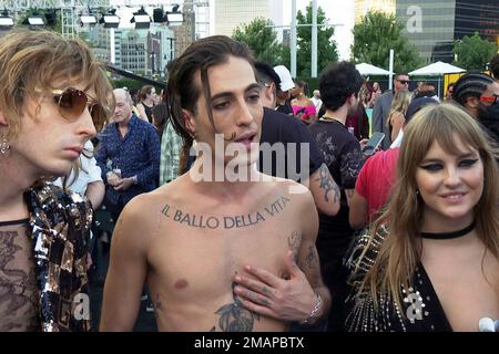 Members of the Maneskin band, from left, Damiano David, Ethan Torchio ...