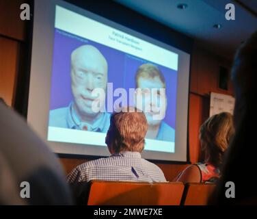 Former Mississippi firefighter Patrick Hardison, 42, center, views a ...