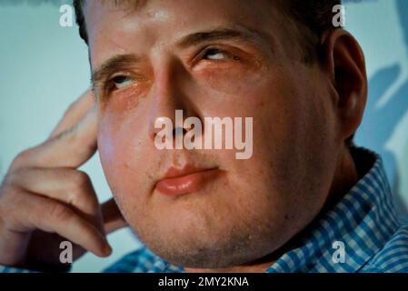 Former Mississippi firefighter Patrick Hardison, 42, center, views a ...