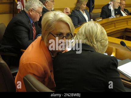 Kansas state Sen. Julia Lynn, right, R-Olathe, confers with Sen. Larry ...