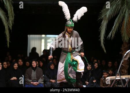 Iranian Mohammad Reza Rajabi, center, and Morteza Namaki perform in a ...