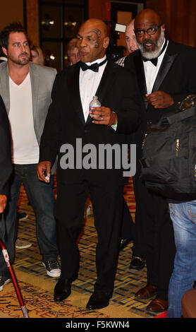 Former heavyweight champions Mike Tyson, center, and Evander Holyfield ...