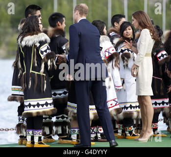 Catherine Middleton, Duchess of Cambridge, dressed in a white Alexander ...