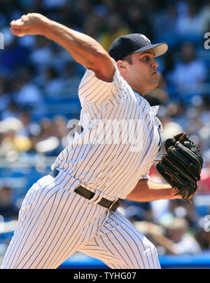 New York Yankees pitcher Jaret Wright wipes his forehead after giving ...