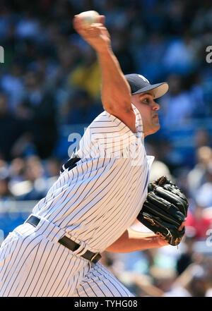 New York Yankees pitcher Jaret Wright wipes his forehead after giving ...